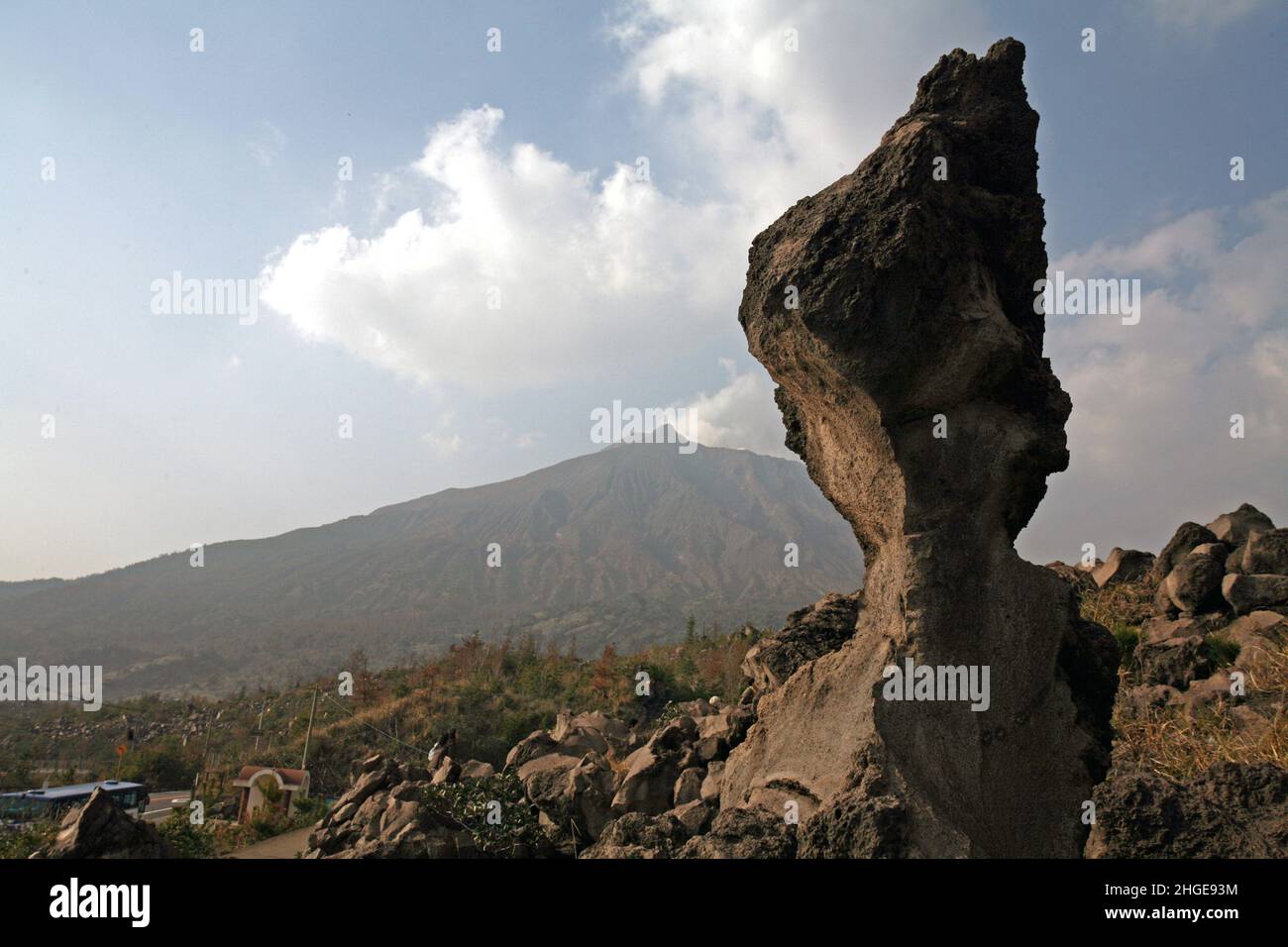 the Sakurajima volcano can be seen in the distance across the bay from ...