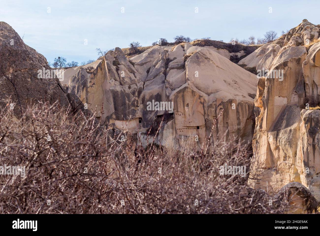 Cave houses and buildings in Cappadocia, Turkey. Stone peaks with doors ...