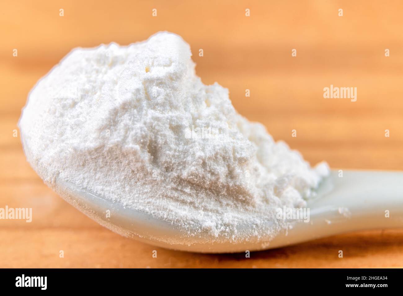 Cream of tartar powder in a white spoon Stock Photo - Alamy