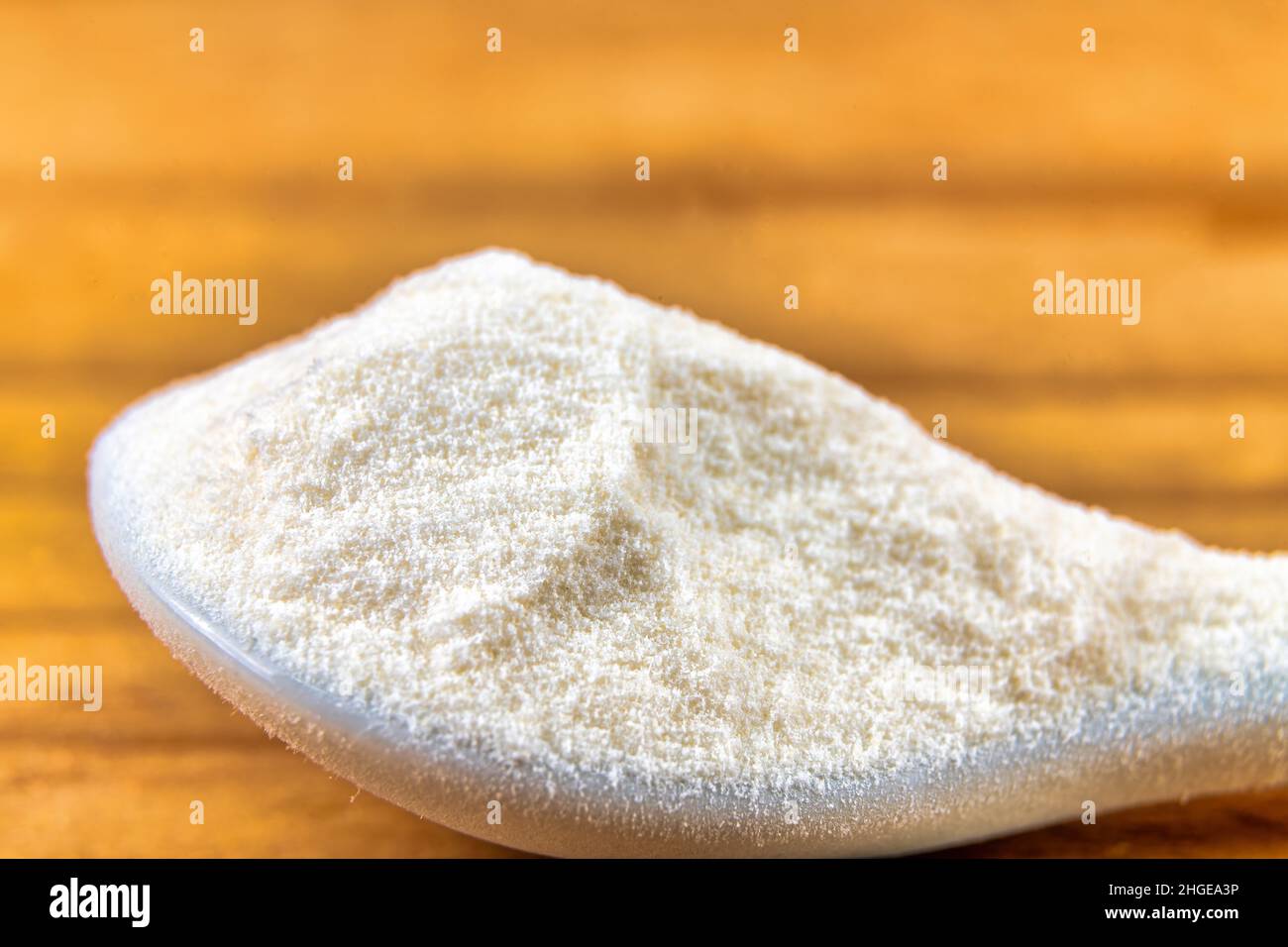 Macro of xanthan gum powder in a wood background Stock Photo - Alamy