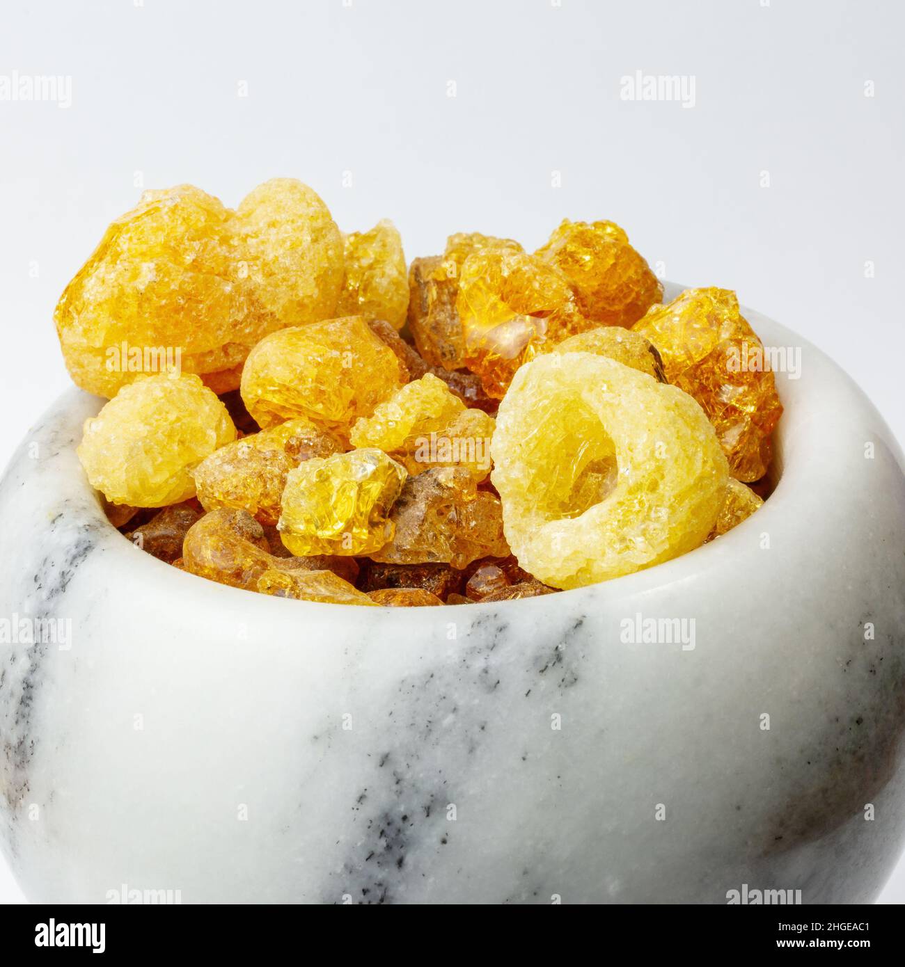 A pile of Gum arabicum (Acacia gum) chunks in a white stone bowl Stock ...