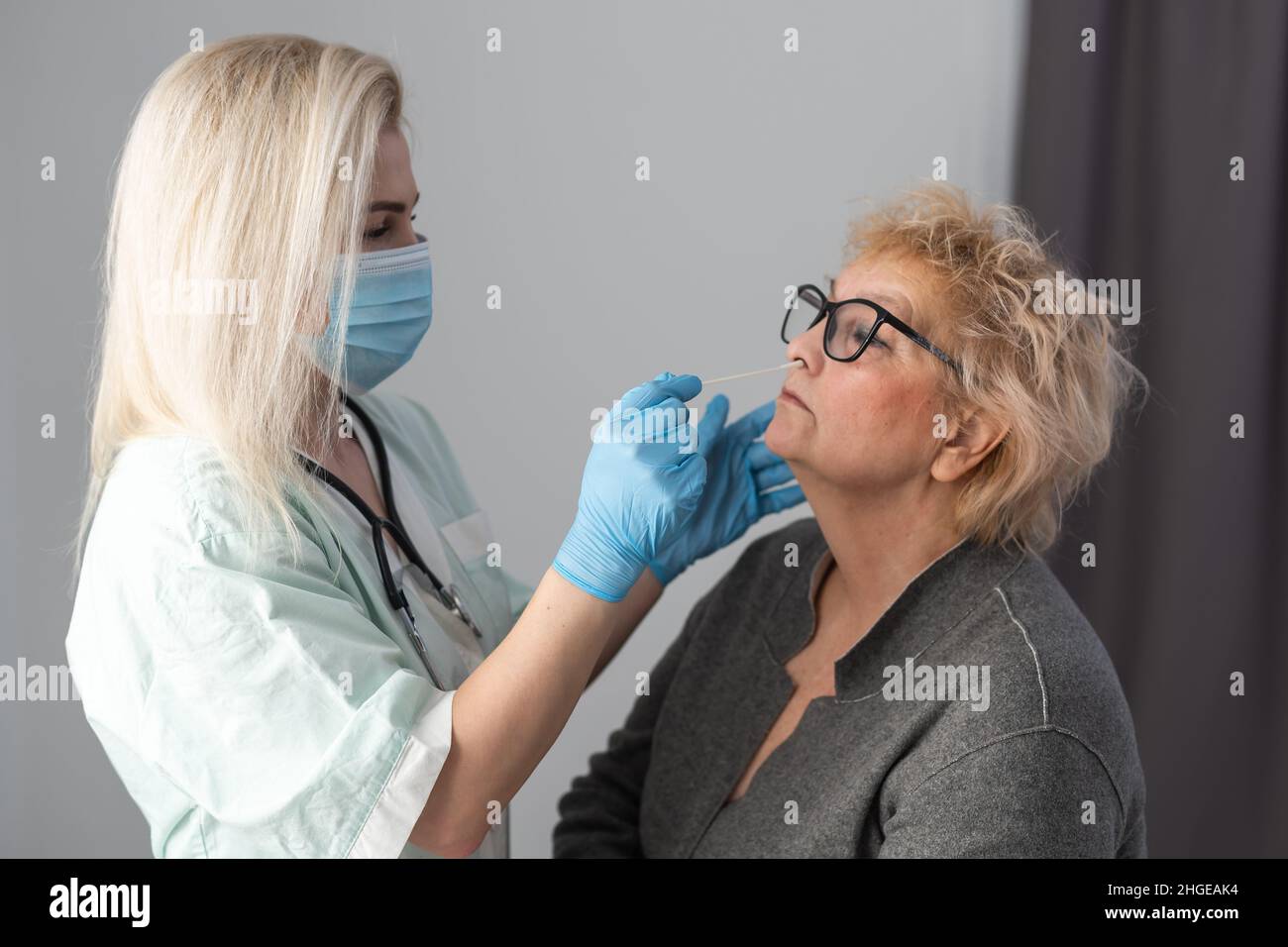Professional medical worker wearing personal protective equipment ...