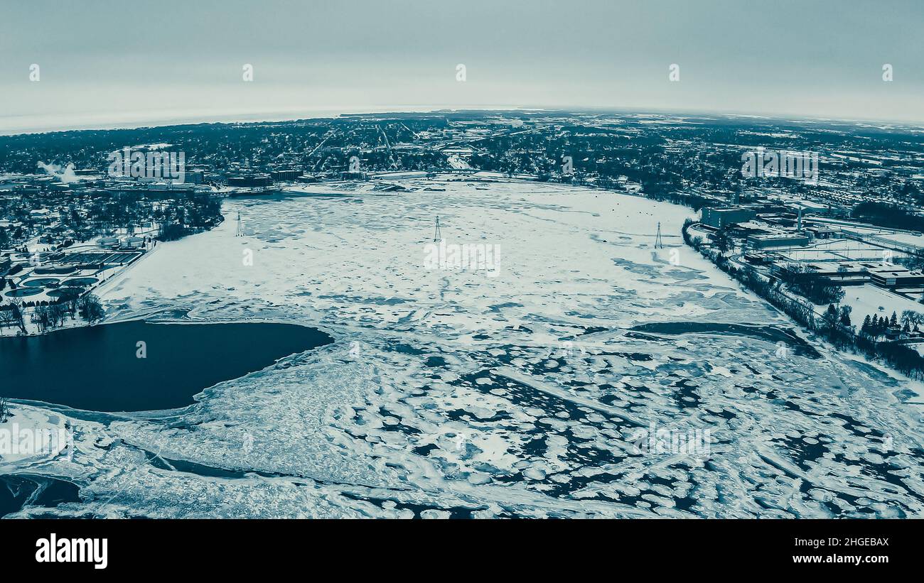 Winter snow covered Lake with ice and open water Stock Photo - Alamy