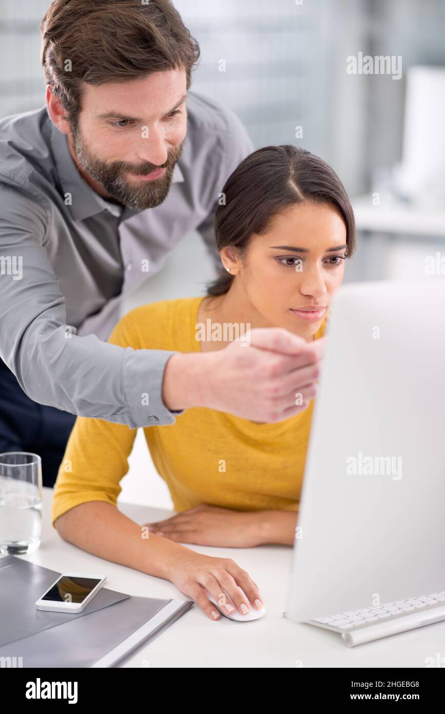 Collaborating on an important project. Two colleagues working together ...