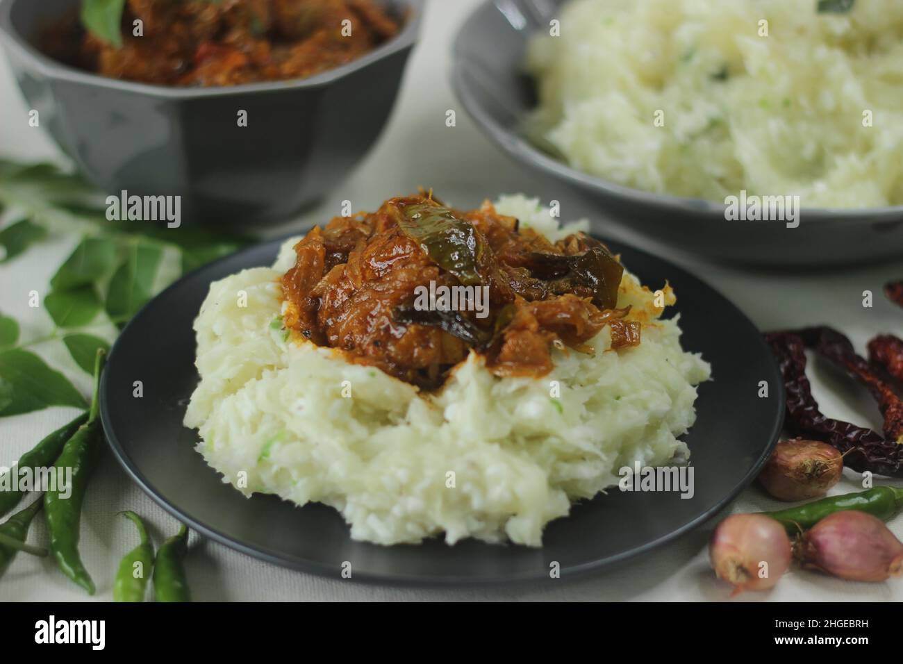 Smashed tapioca with green chilies and shallots served with chicken ...