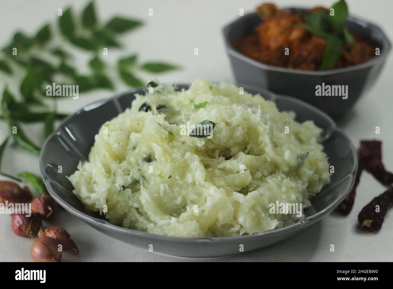 Smashed tapioca with green chilies and shallots served with chicken ...