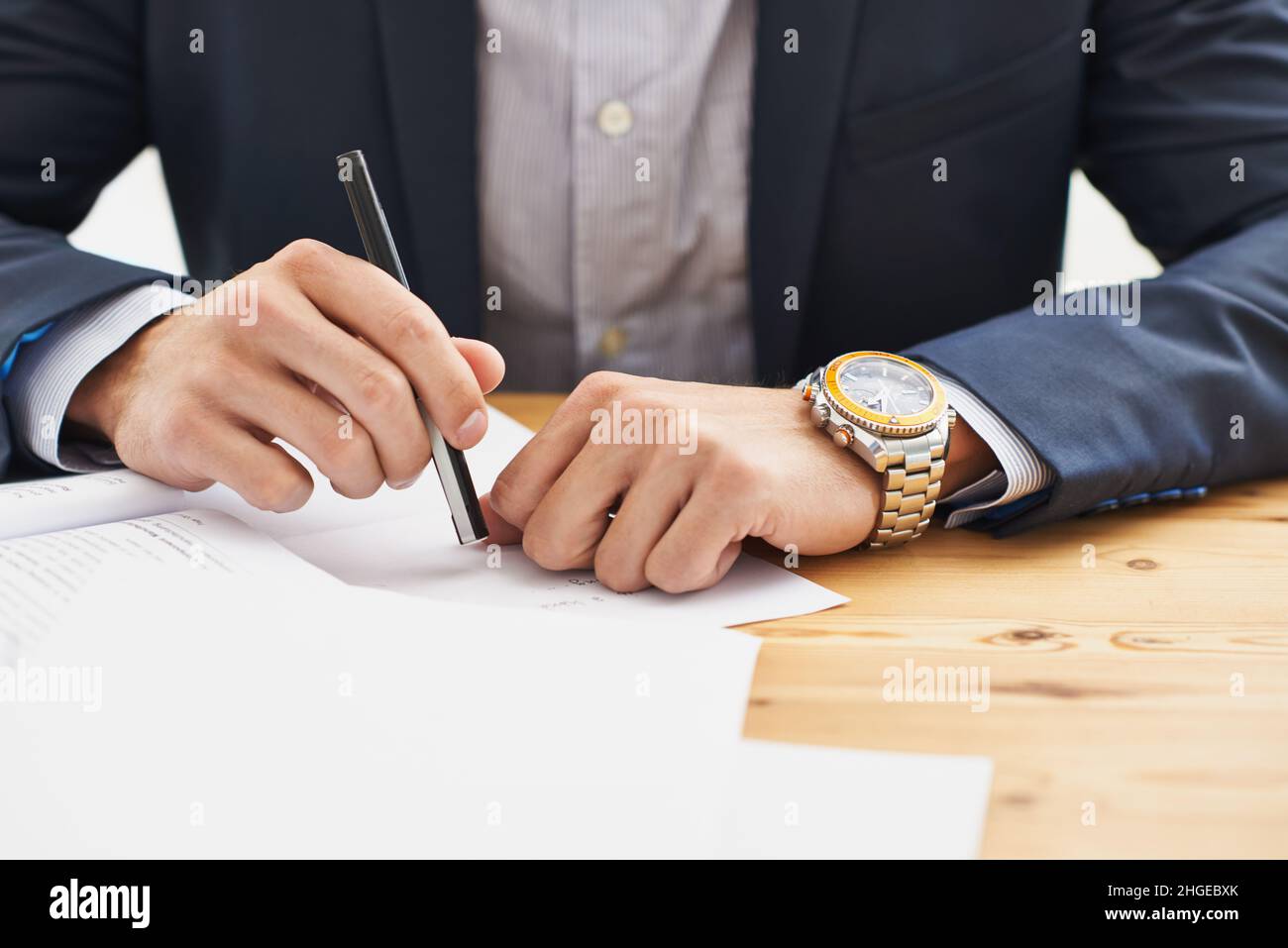 Making lists. Cropped shot of a business man writing Stock Photo - Alamy