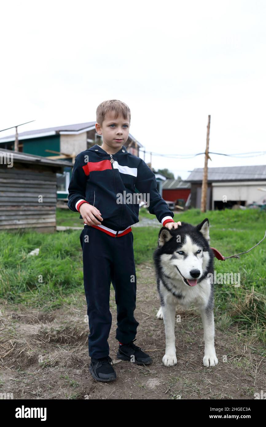 Children playing husky dog hi-res stock photography and images - Alamy