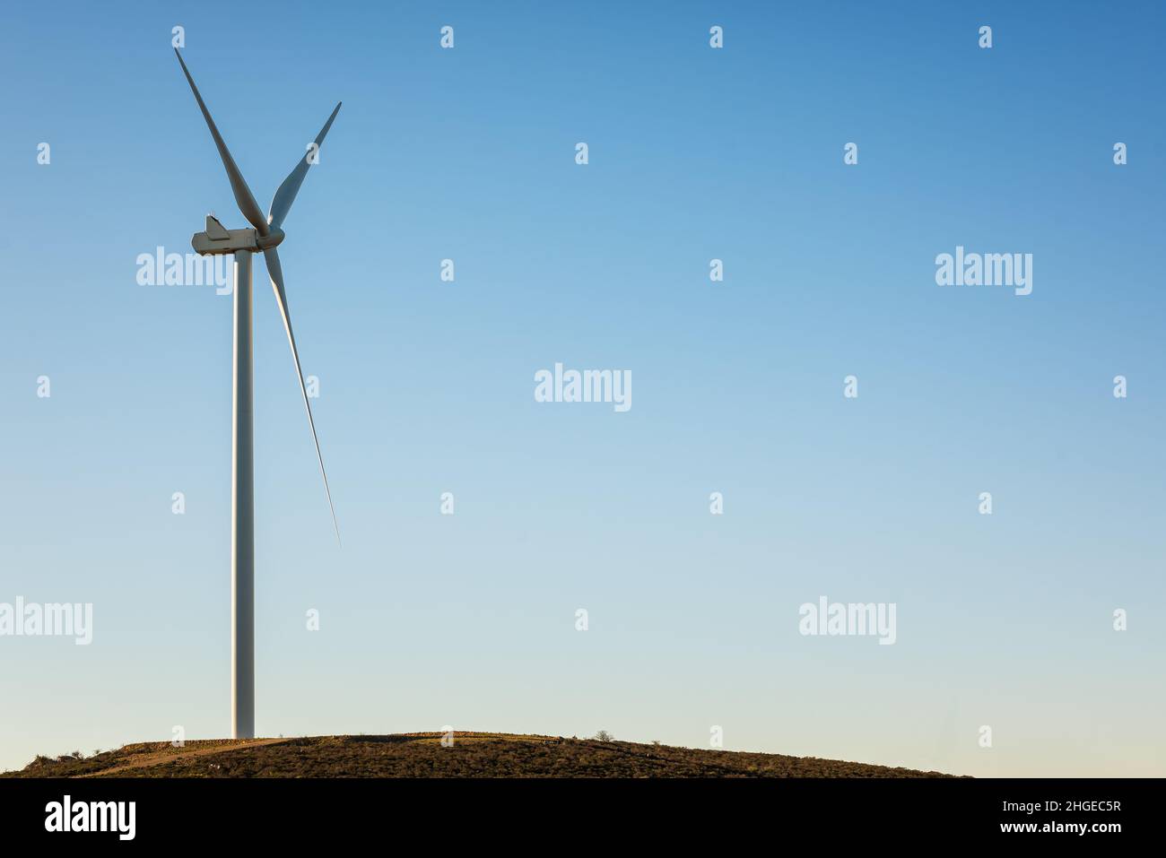 Wind turbines on a beautiful blue sky in a mountain wind farm in ...