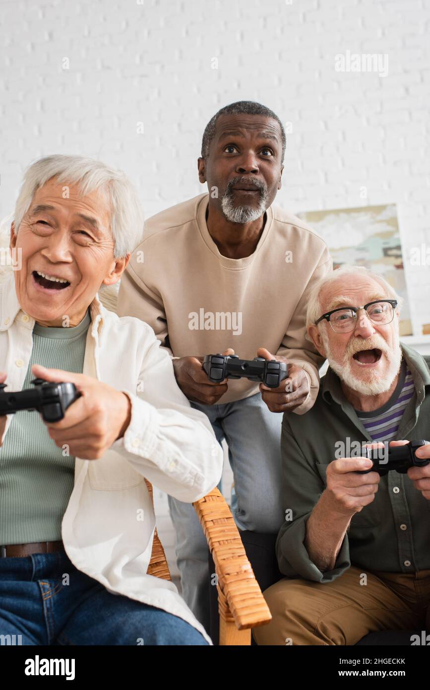 Elderly multiethnic men playing hi-res stock photography and images - Alamy