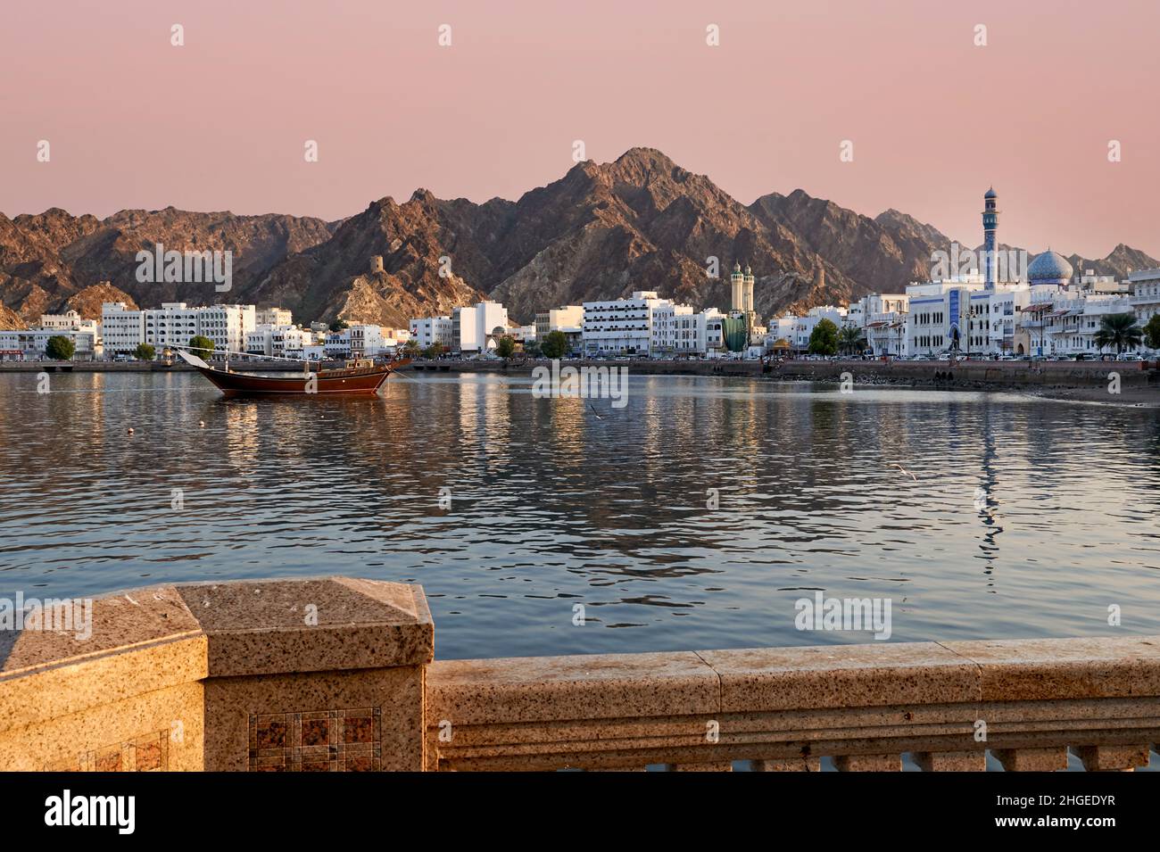 Oman. Muscat. Cityscape at sunset Stock Photo - Alamy