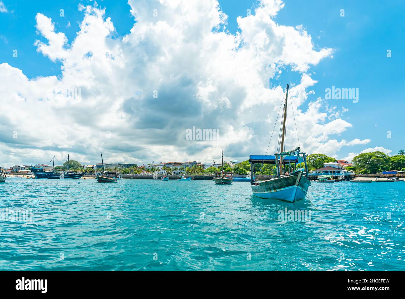 STONE TOWN, ZANZIBAR - DECEMBER 22, 2021: Boats in a port of Stone Town ...