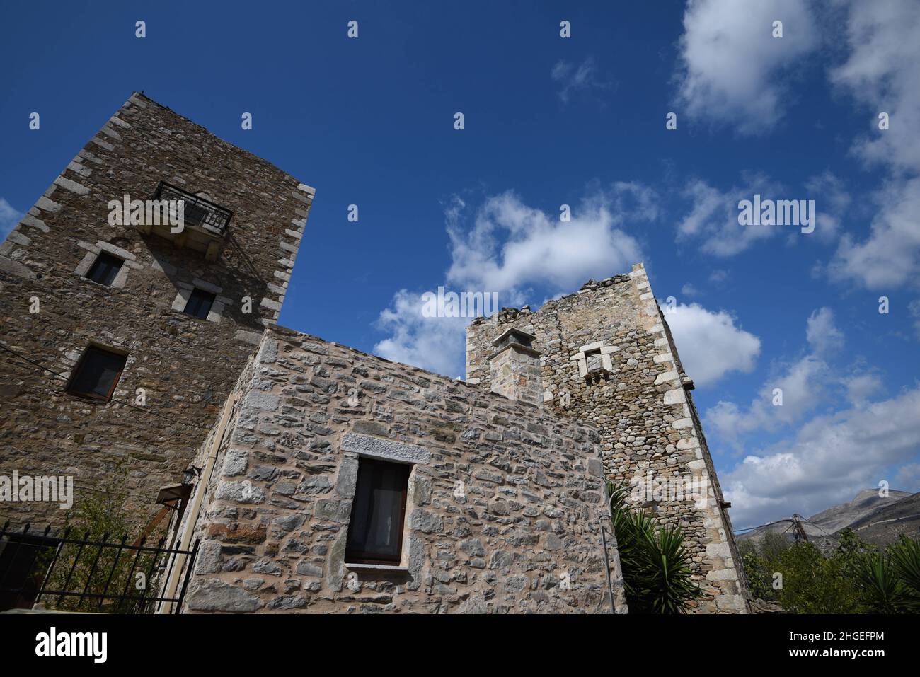 Landscape with scenic view of a stone built tower-mansion in the ...