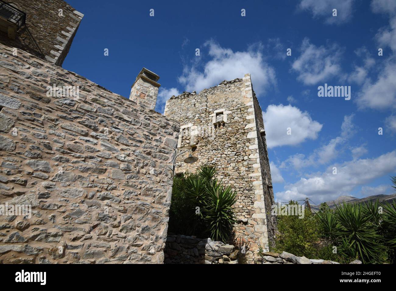 Landscape with scenic view of a stone built tower-mansion in the ...