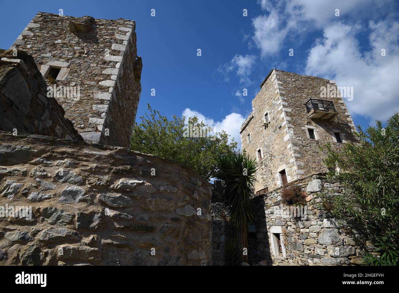 Landscape with scenic view of a stone built tower-mansion in the ...