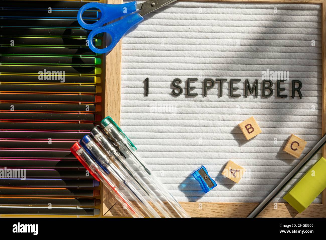 1 september letter board with school supplies as pens, scissors, ABC ...