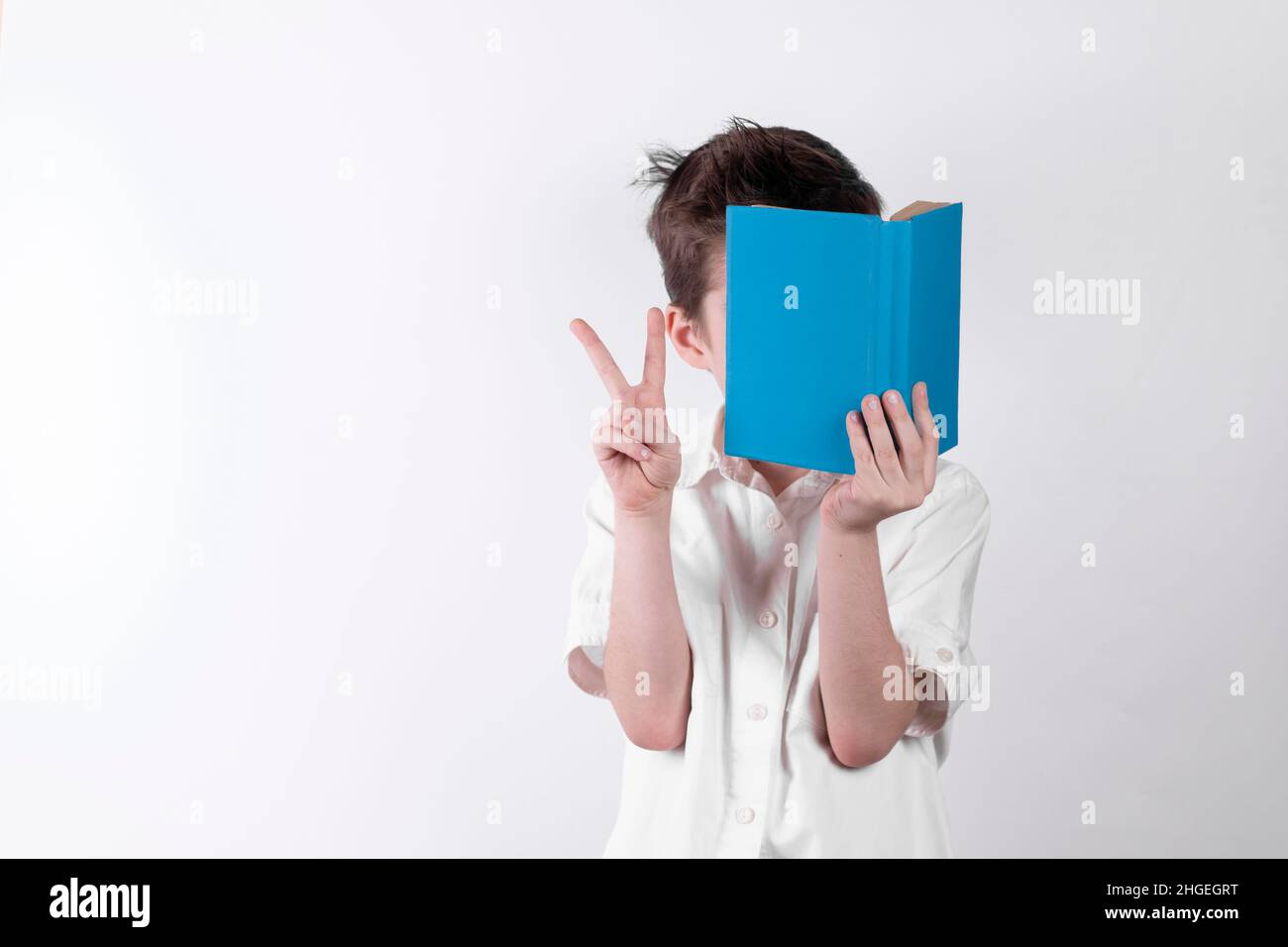 Girl Hiding Face With Book