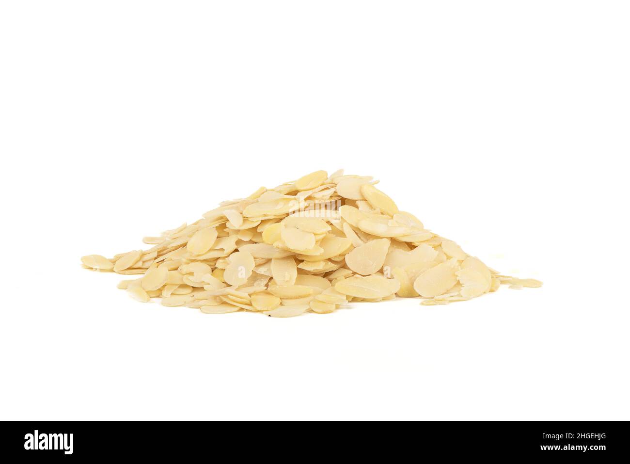 Culinary almond petals from peeled almond kernels on a white background ...
