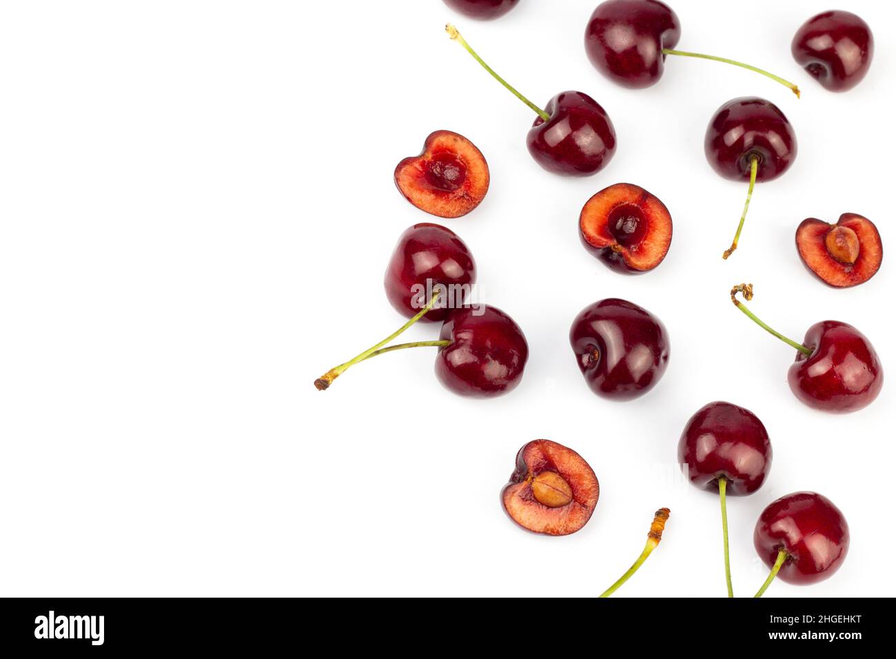 Red fresh cherry and cherry slices isolated on white background Stock ...