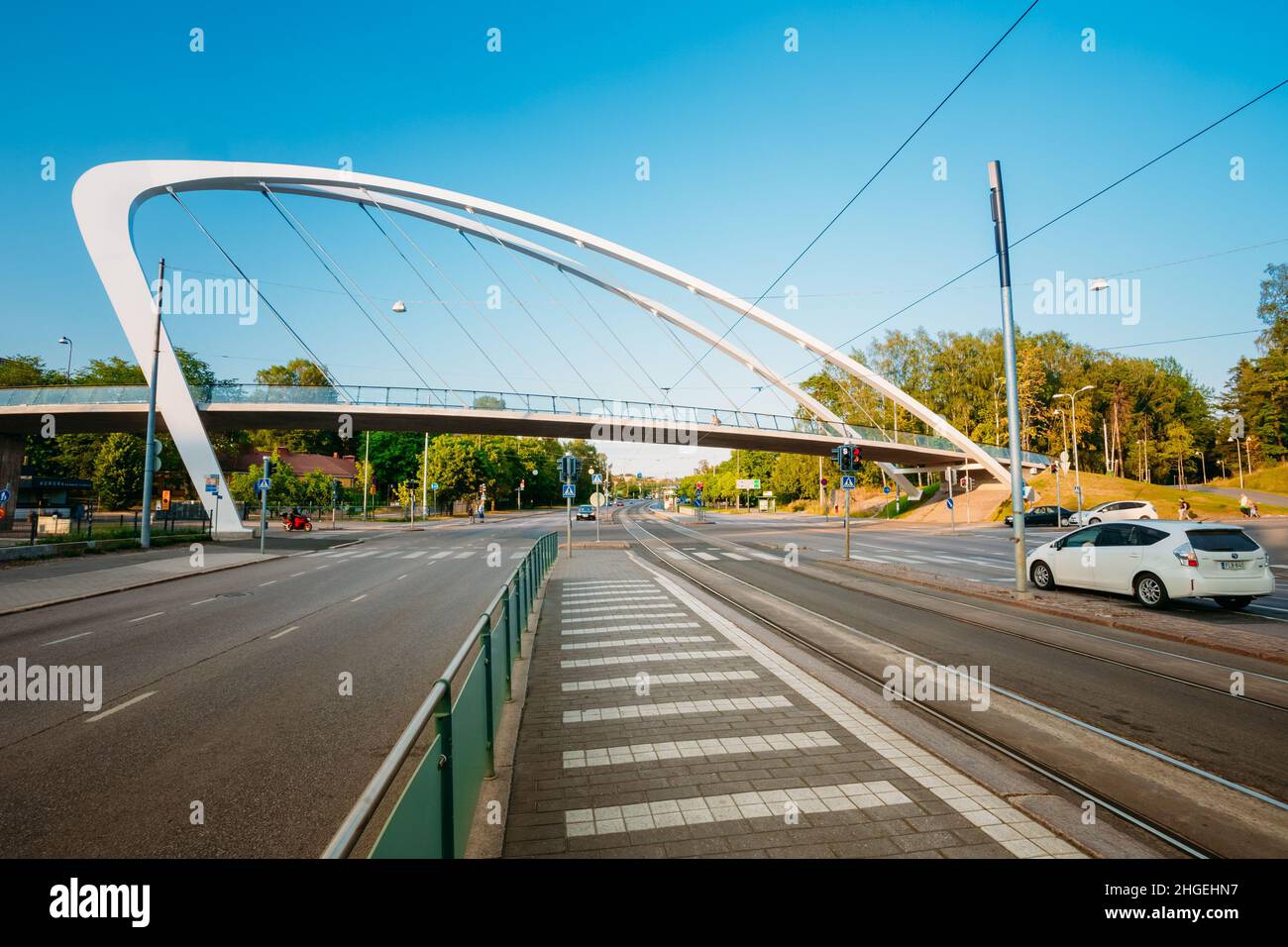 Modern pedestrian bridge over street Stock Photo - Alamy