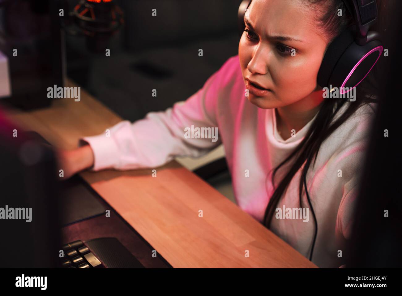 Angry devastated young man gamer wearing headphones lost a game on ...