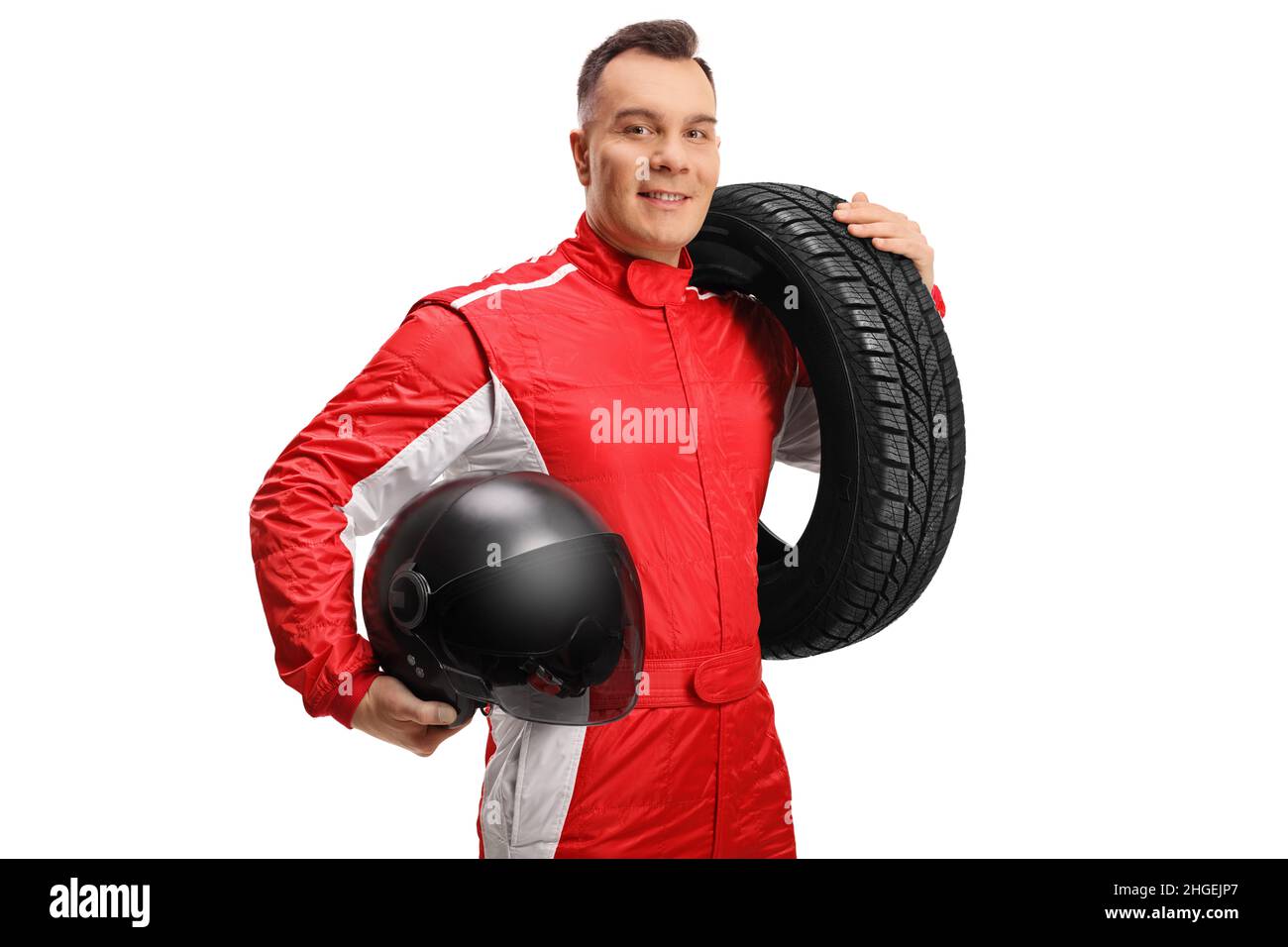 Racer in a red suit holding a tire and a helmet isolated on white ...