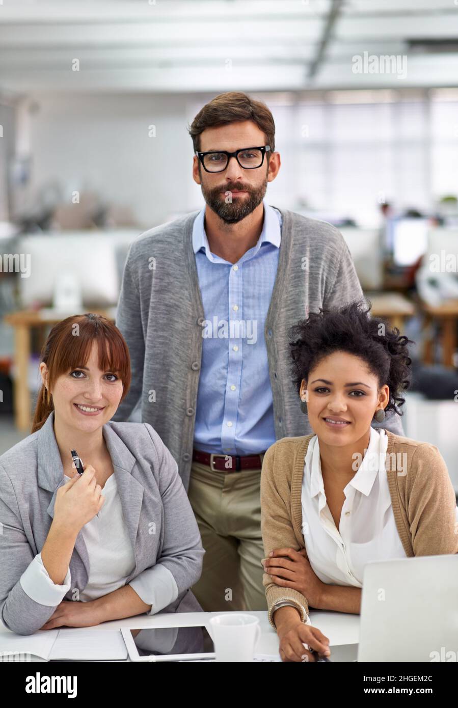 Dynamic young office professionals. Portrait of a group of dedicated ...