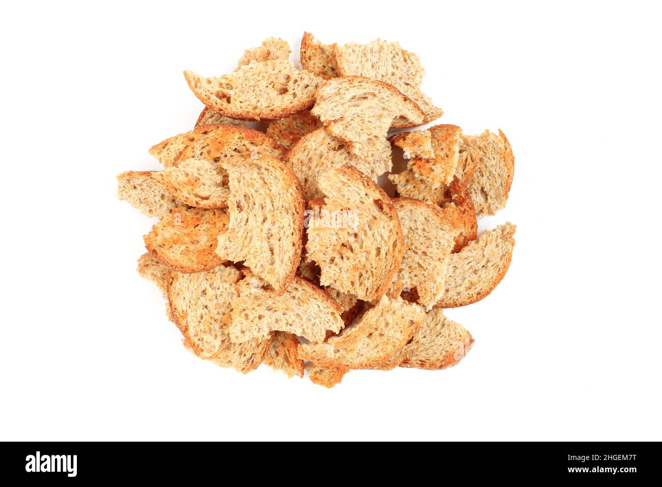 Toasted bread pieces isolated on white background. Pile of flavored ...