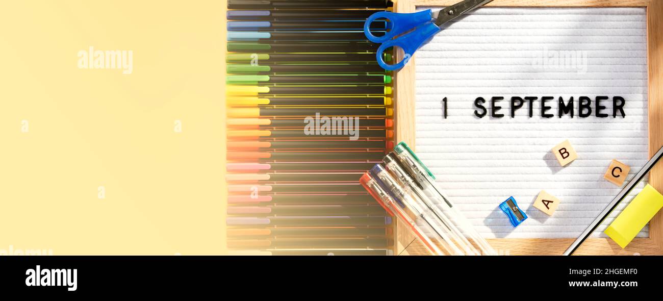 1 september letter board with school supplies as pens, scissors, ABC ...