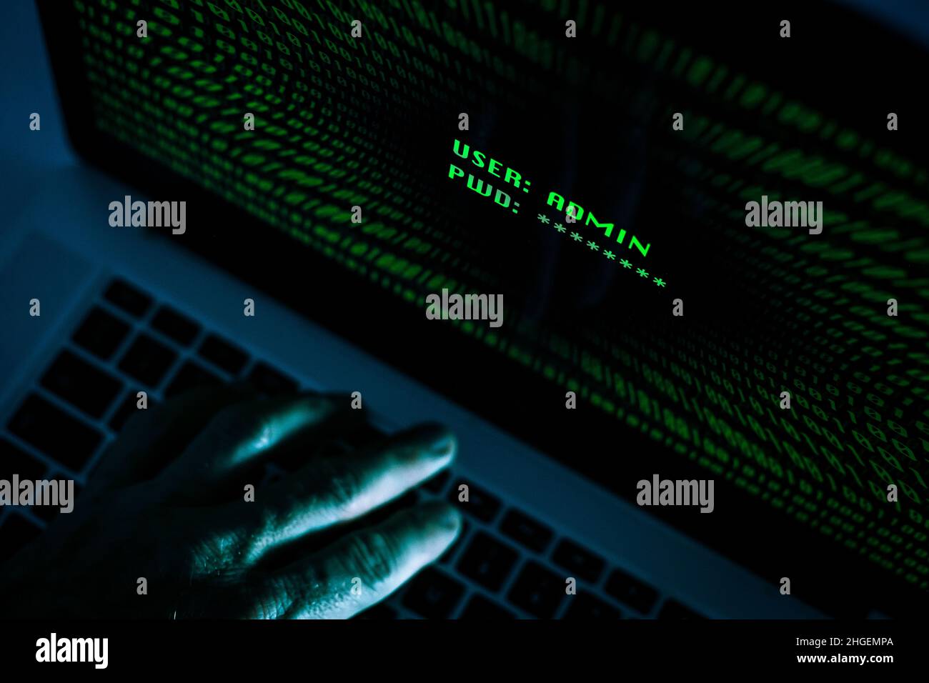 Hand typing on a laptop keyboard green numbers on display. Successful login with credentials ...