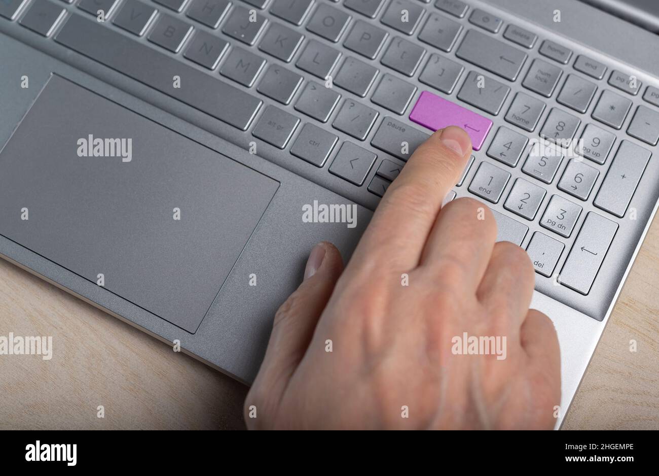 Pressing Enter button on laptops keypad, keyboard Stock Photo - Alamy