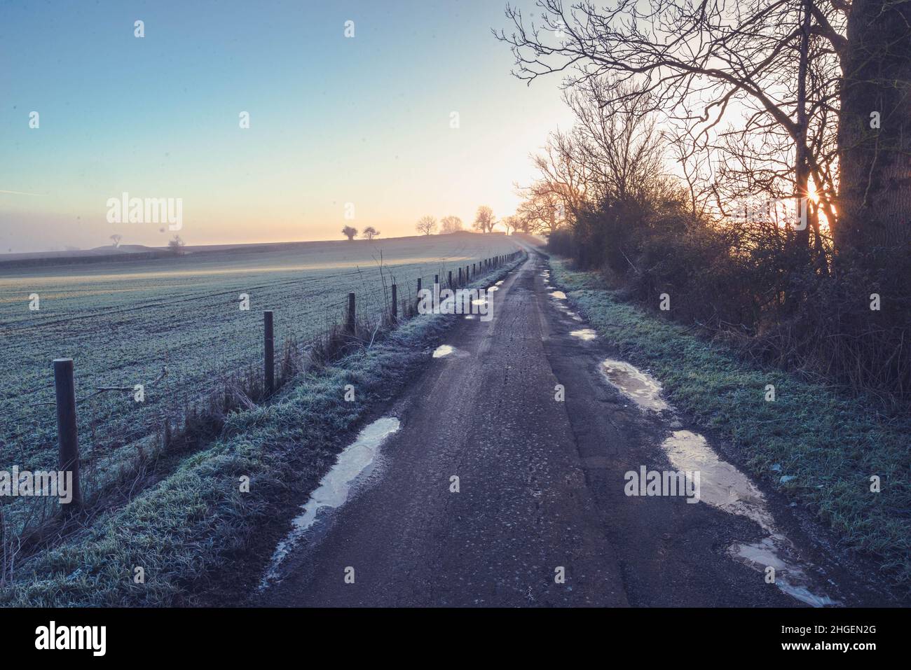 A wintery landscape in the United Kingdom at sunrise Stock Photo - Alamy