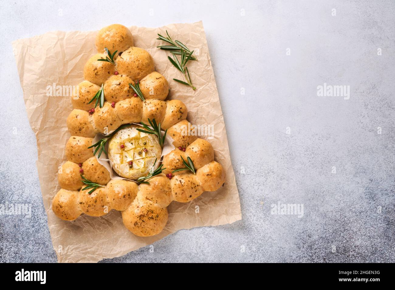 Bread buns Christmas tree with Roasted camembert cheese and rosemary on ...
