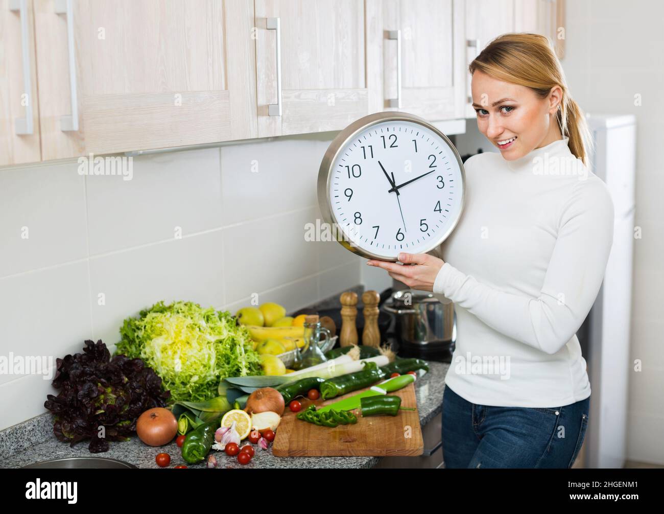 Woman and clock and food hi-res stock photography and images - Alamy