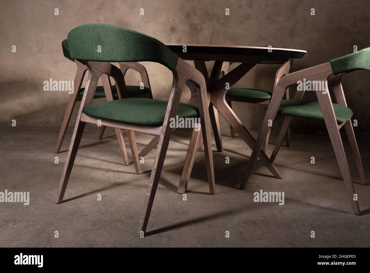 Beautiful brown wooden folding table on beige concrete background ...