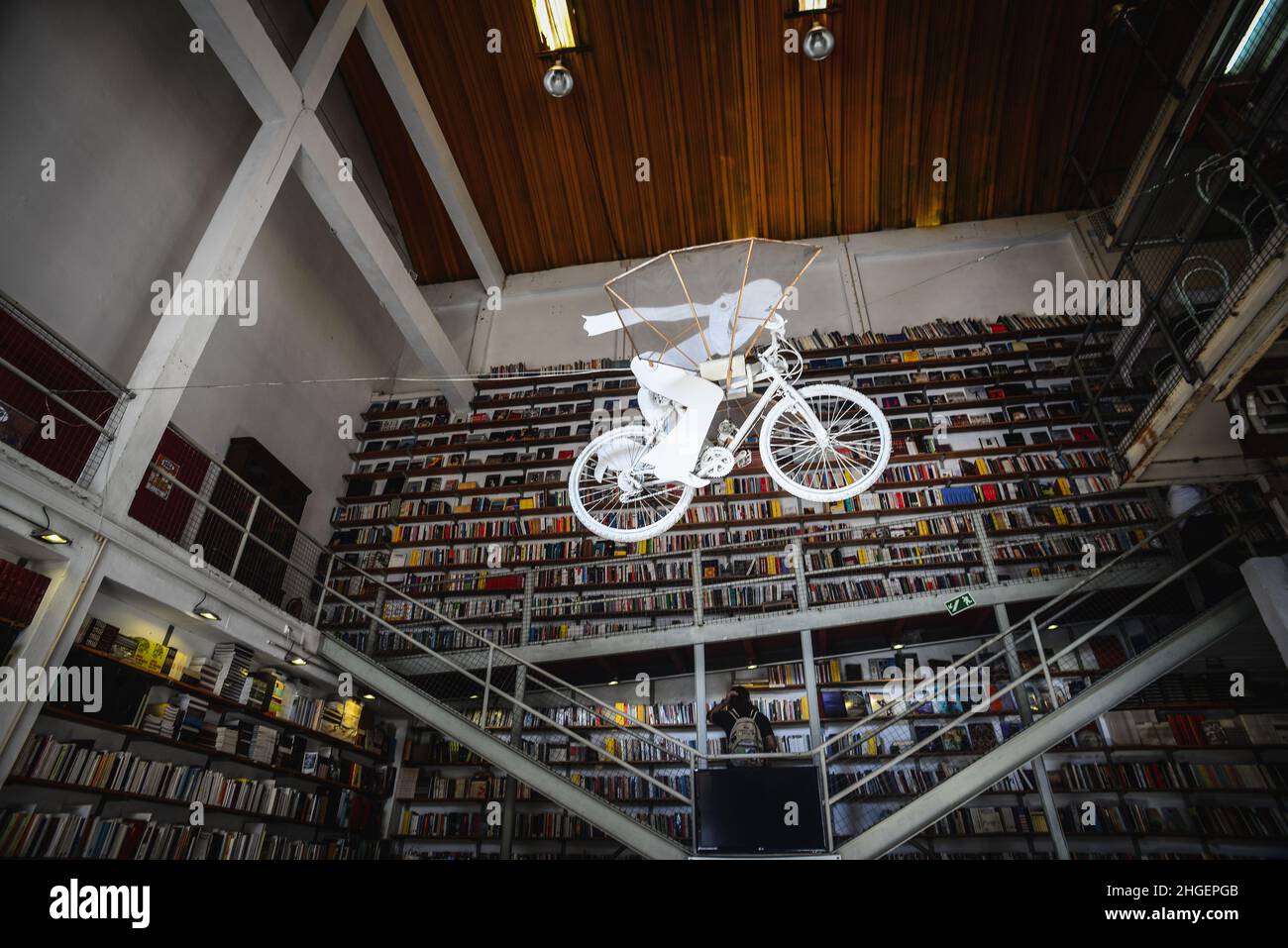 Flying bicycle inside “Ler Devagar” (“Read Slowly”) bookstore, named ...