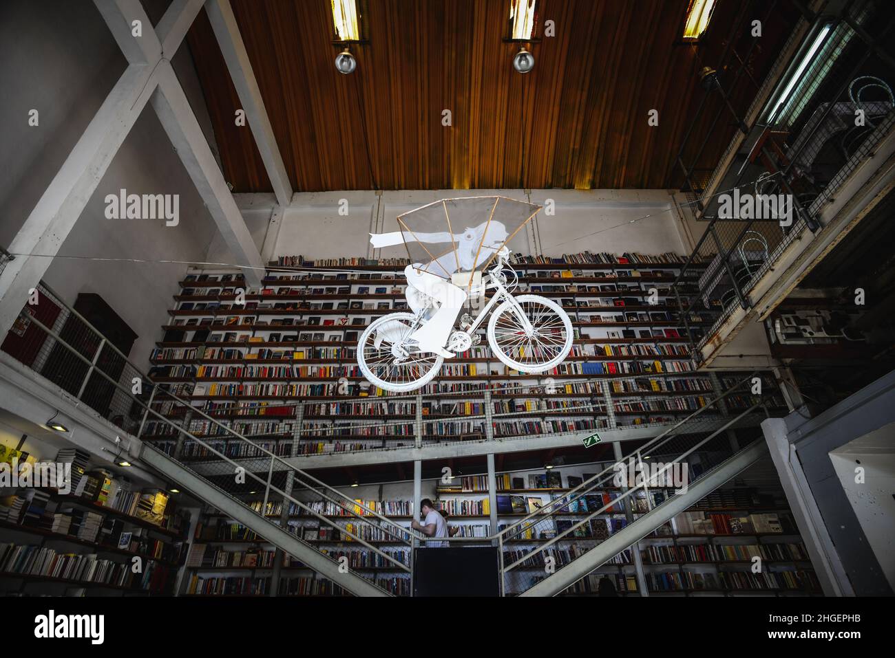 Flying bicycle inside “Ler Devagar” (“Read Slowly”) bookstore, named ...
