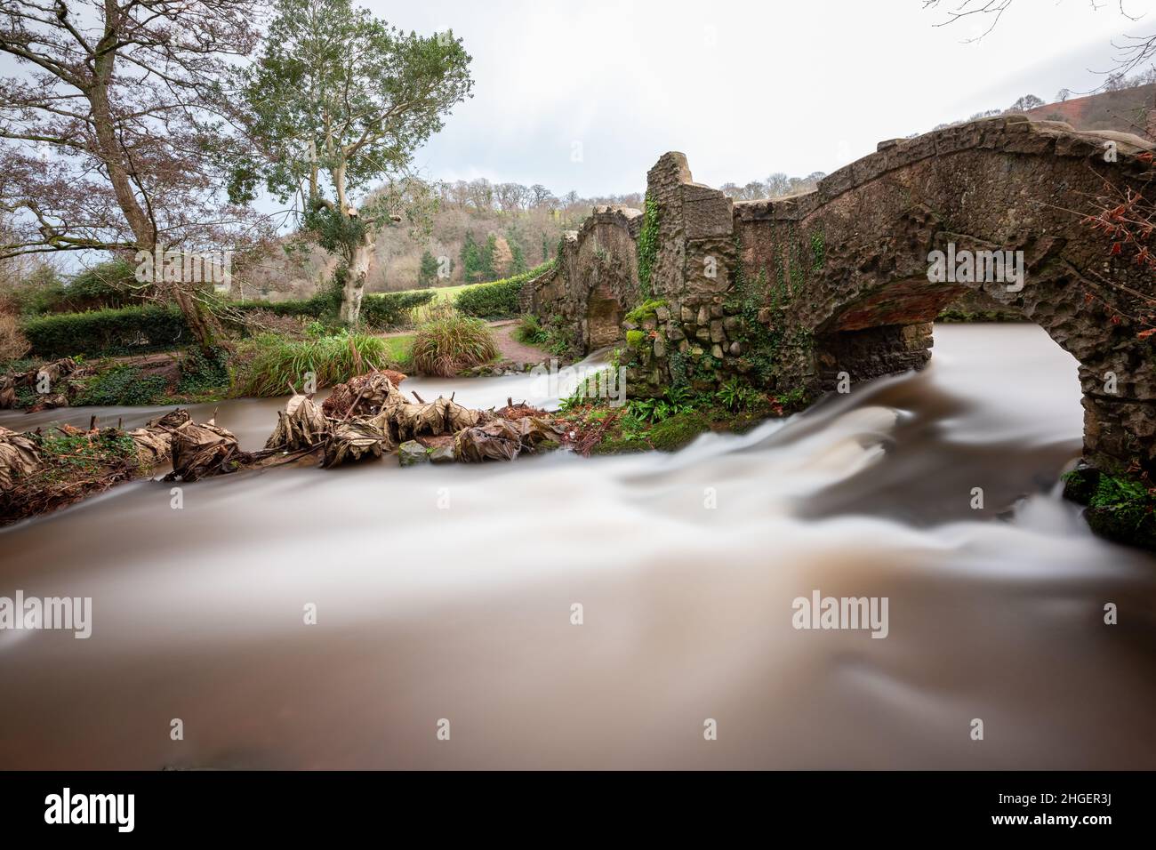 Long exposure of the river Avill flowing under Lovers bridge in the ...