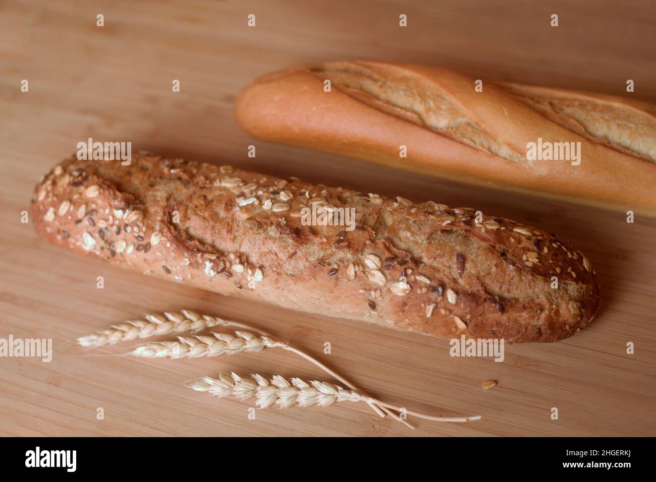 Different types of bread, fresh pastries in the bakery. Bread with ...
