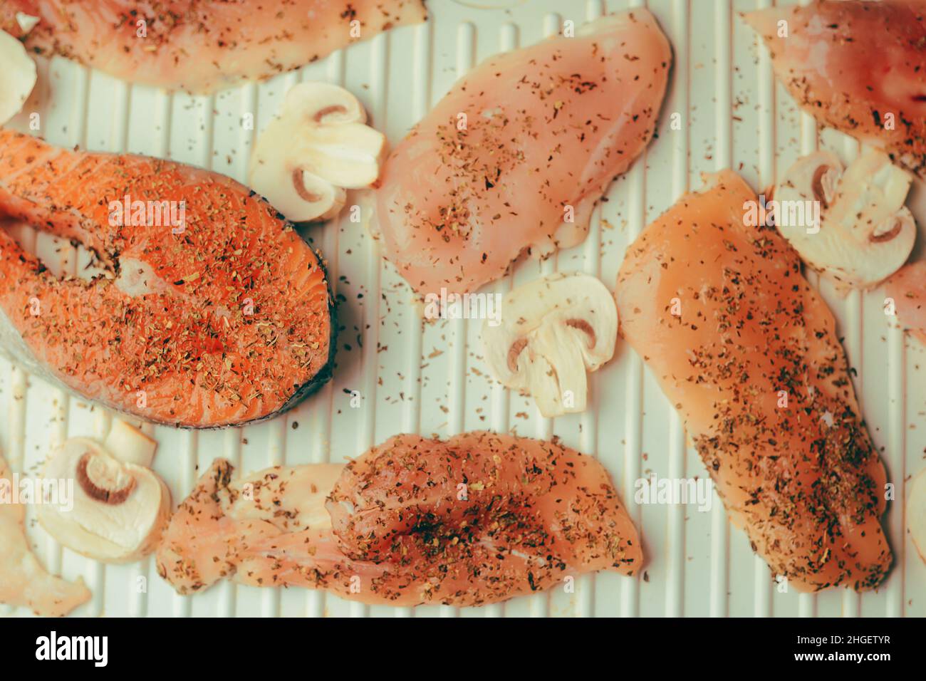 Photo of salmon. Fresh red fish rich color. Mushrooms and chicken ...