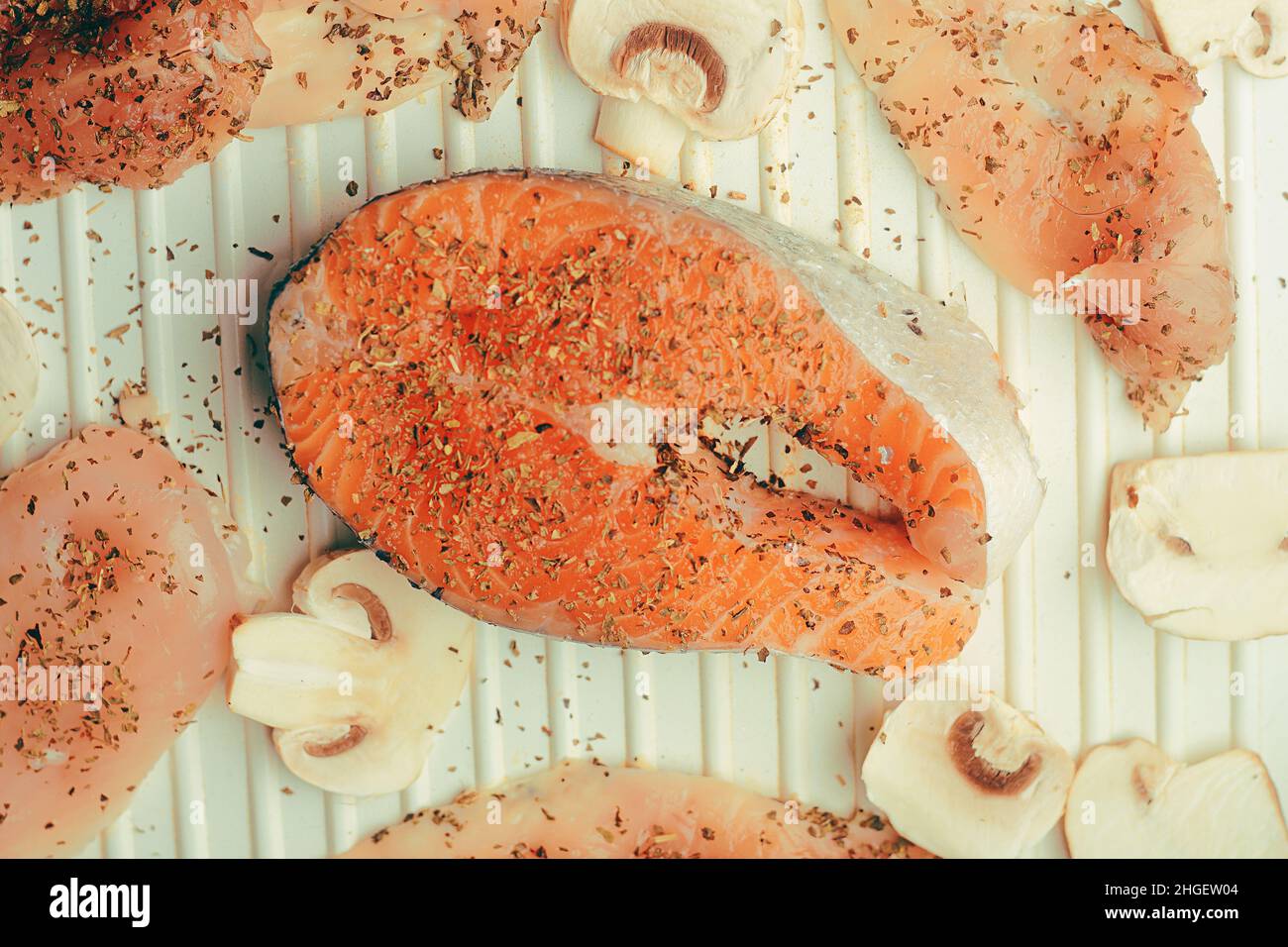 Photo of salmon. Fresh red fish rich color. Mushrooms and chicken ...