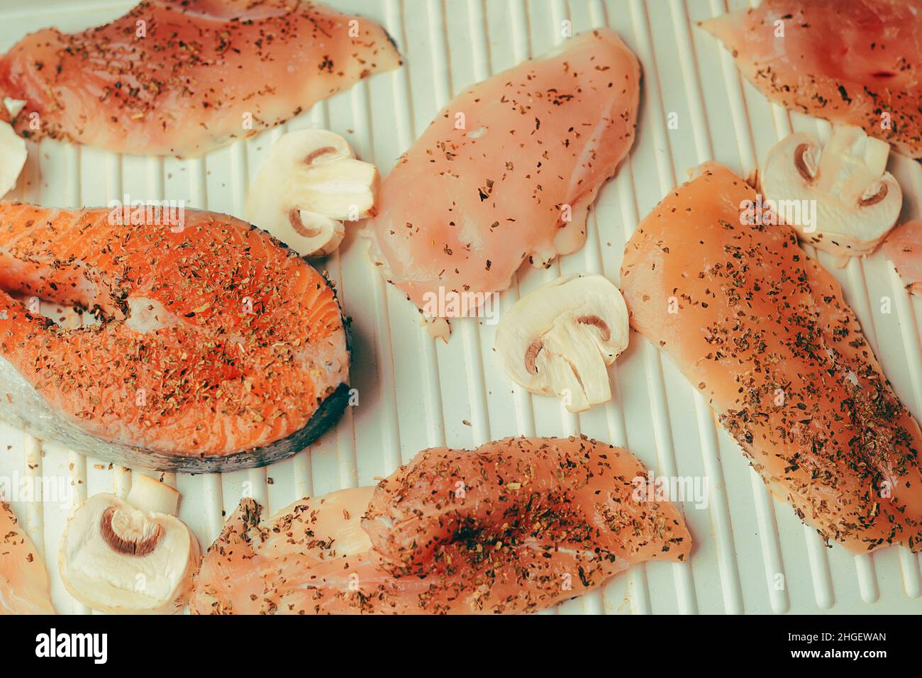 Photo of salmon. Fresh red fish rich color. Mushrooms and chicken ...