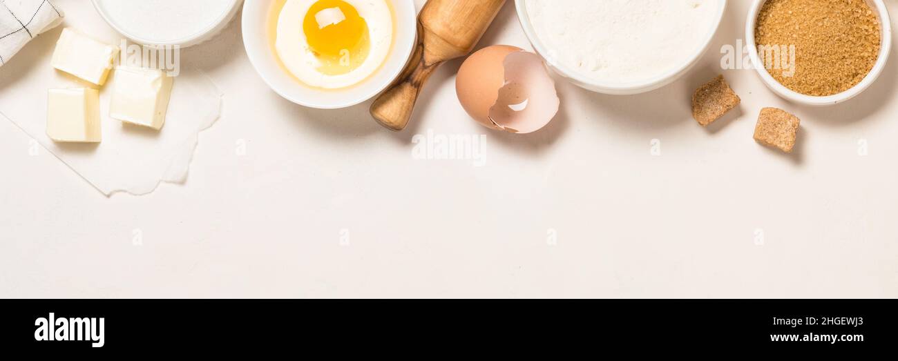 Baking ingredients at blue table top view Stock Photo - Alamy
