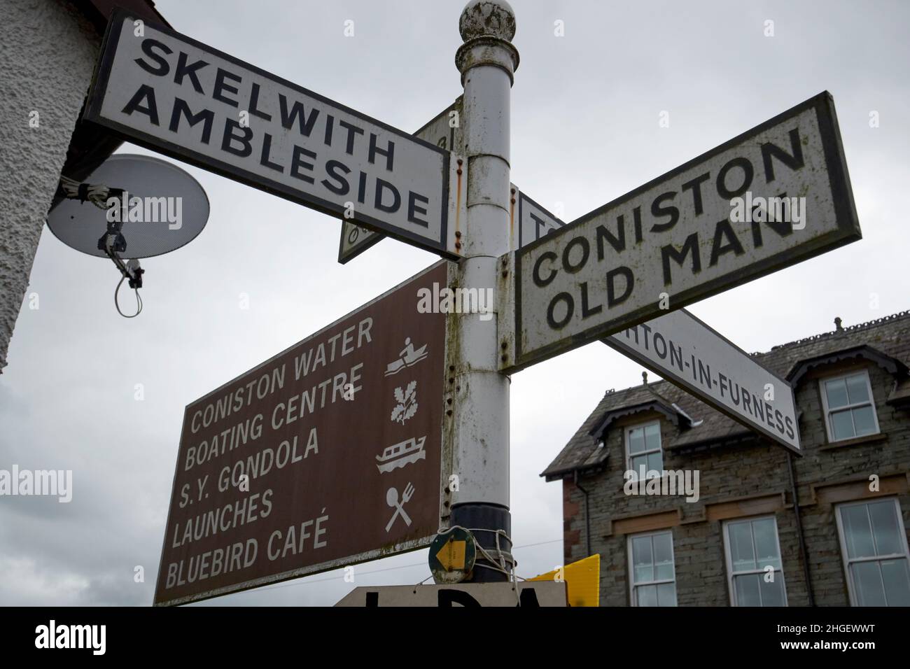 metal old traditional roadsign in coniston for skelwith ambleside and ...