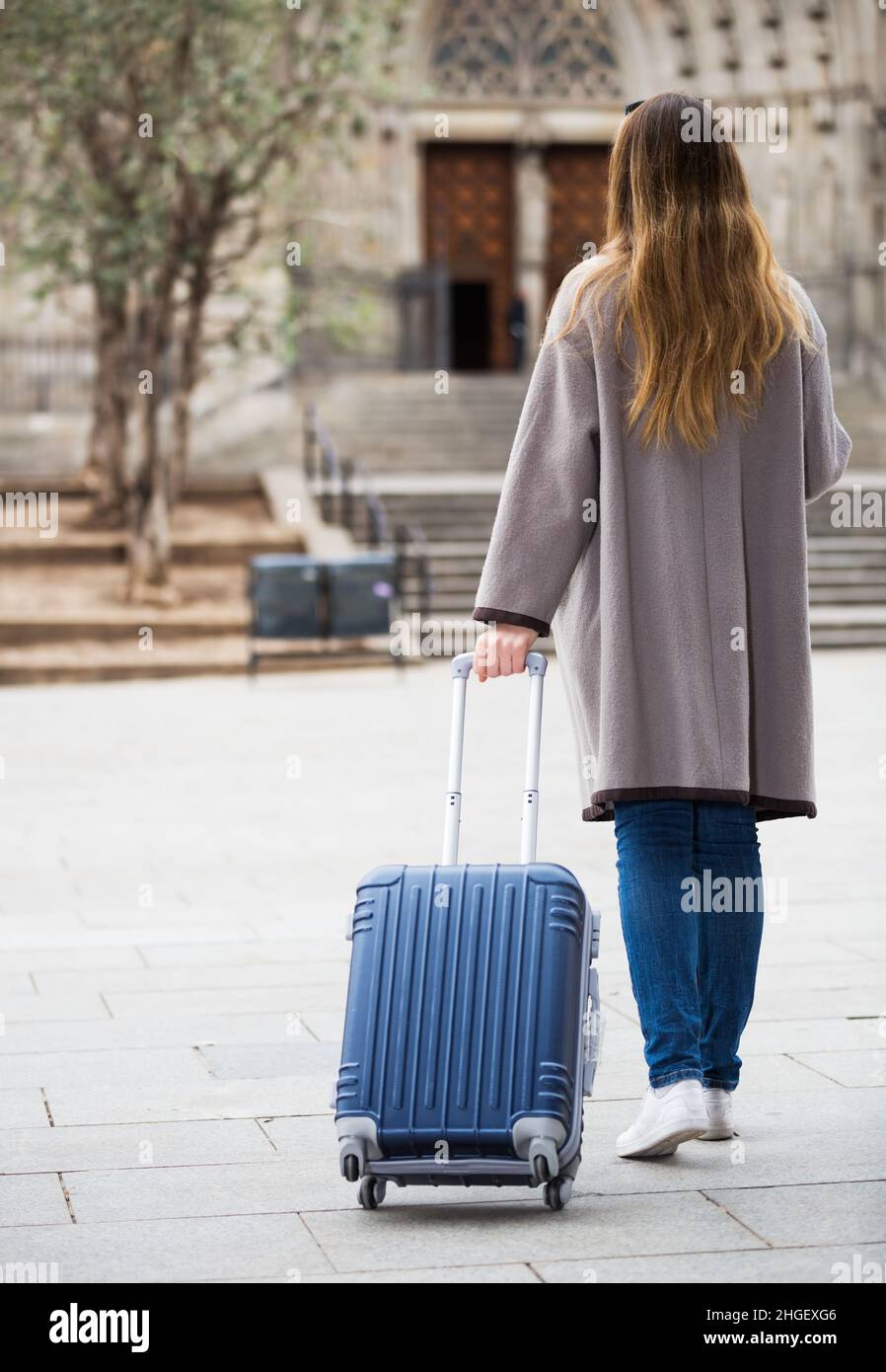 Girl taking a walk with the travel bag Stock Photo - Alamy