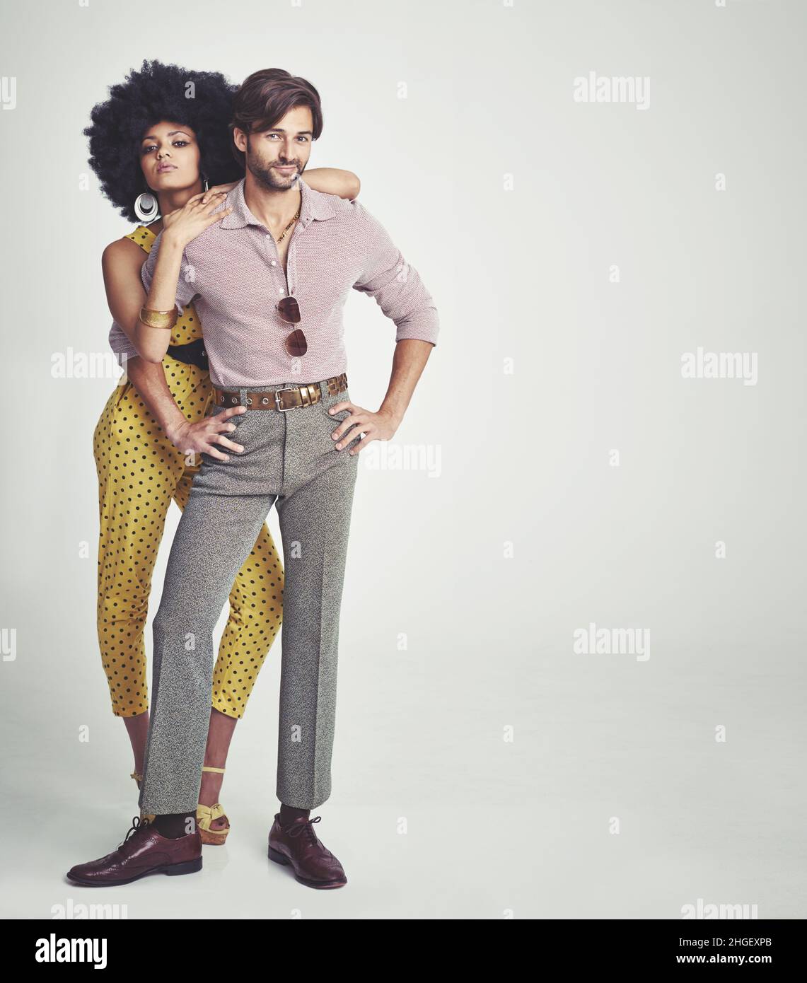 The perfect retro couple. An attractive young couple standing together ...