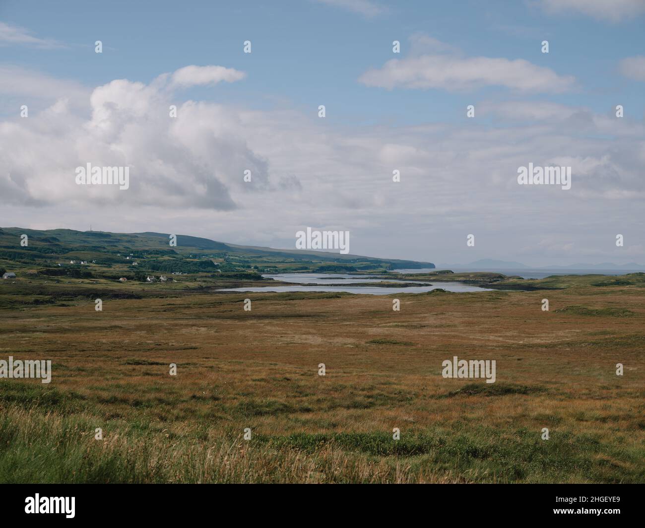 The summer landscape of the Duirinish Peninsula with distant crofts and ...