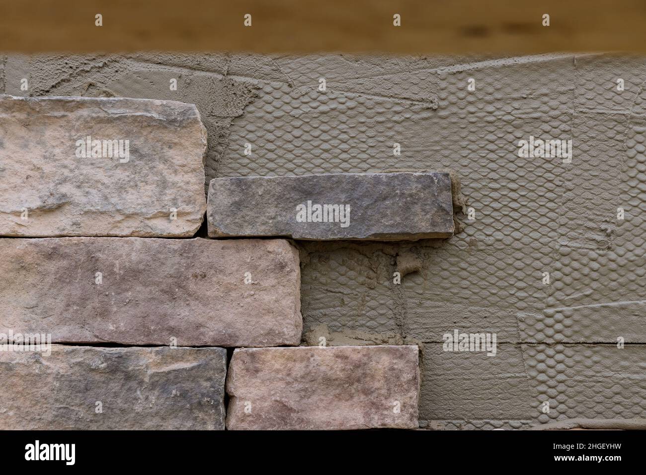 Making texture of wall facing with decorative stone bricks Stock Photo ...