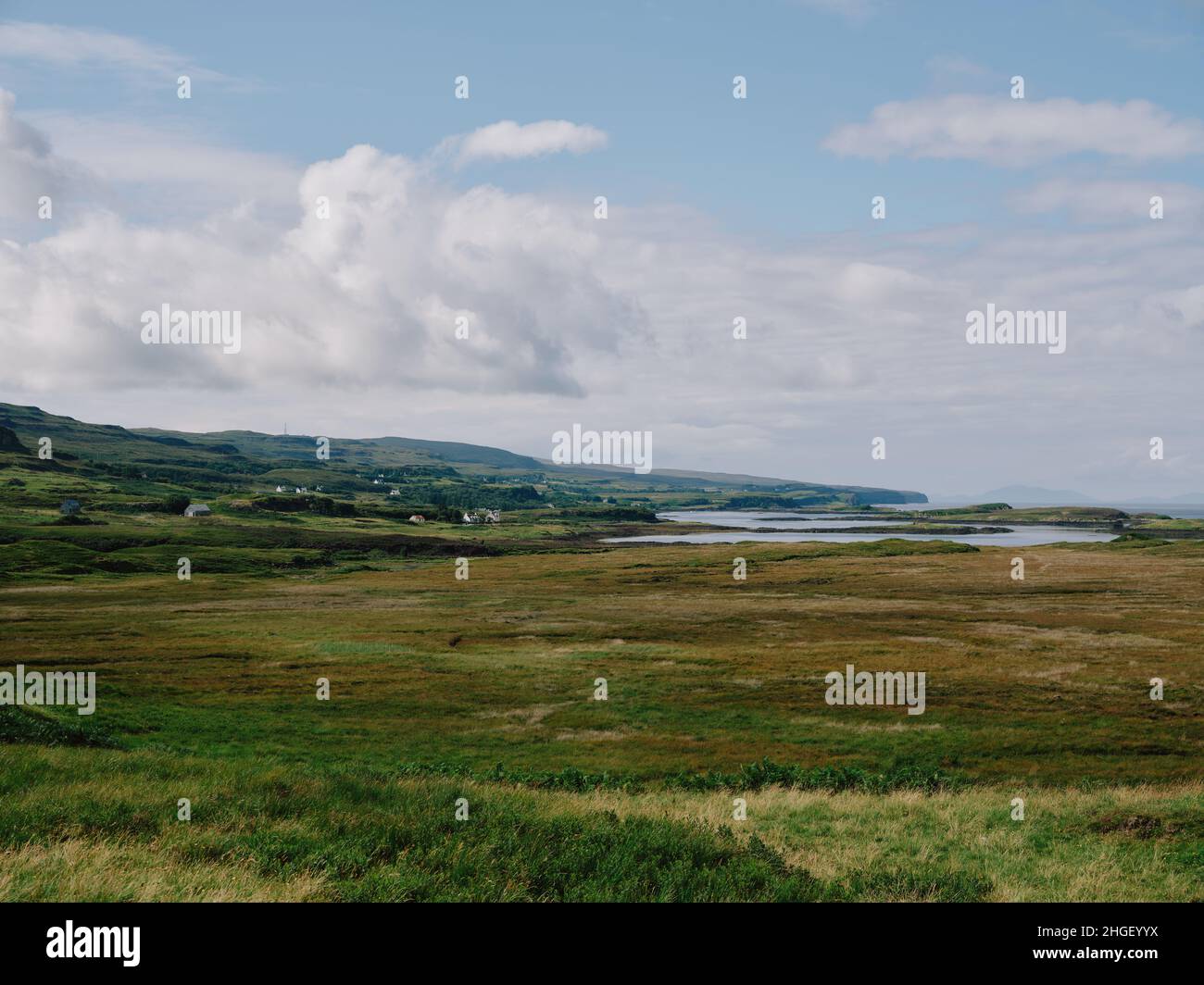 The summer landscape of the Duirinish Peninsula with distant crofts and ...