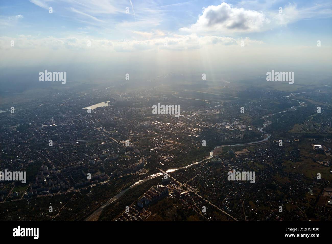 Aerial view from airplane window at high altitude of earth covered with ...